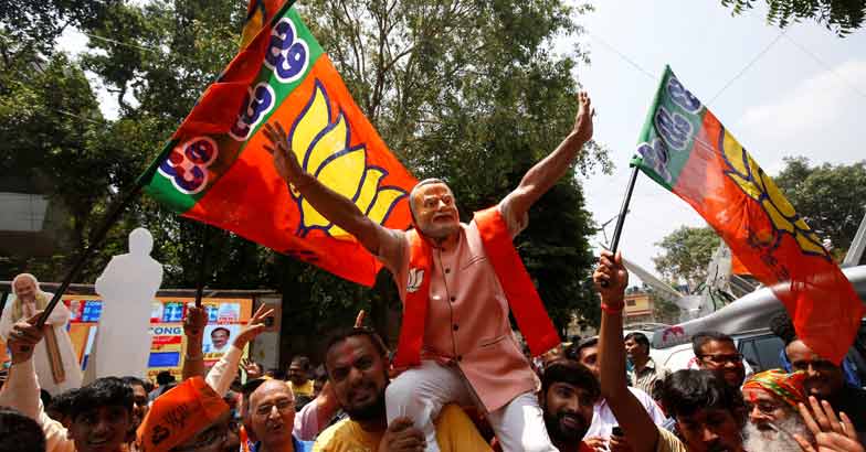 BJP workers celebrate as saffron party dethrones Congress in K'taka ...
