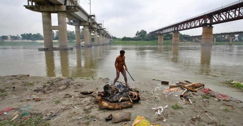 Swelling Ganges opens up Uttar Pradesh's riverside graves