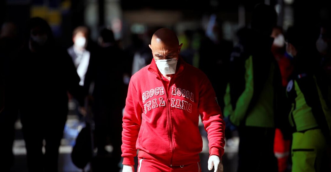 Masked and standing apart, the world tiptoes out of lockdown | World ...