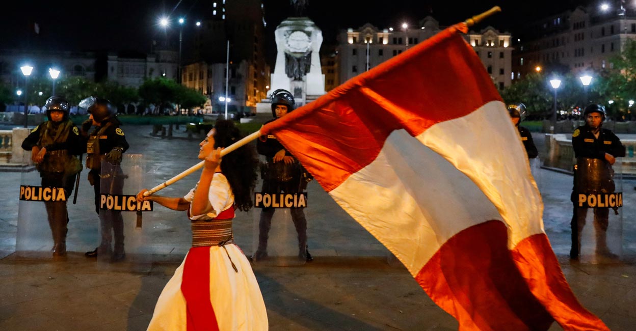 Thousands march in Peru capital demanding president step down